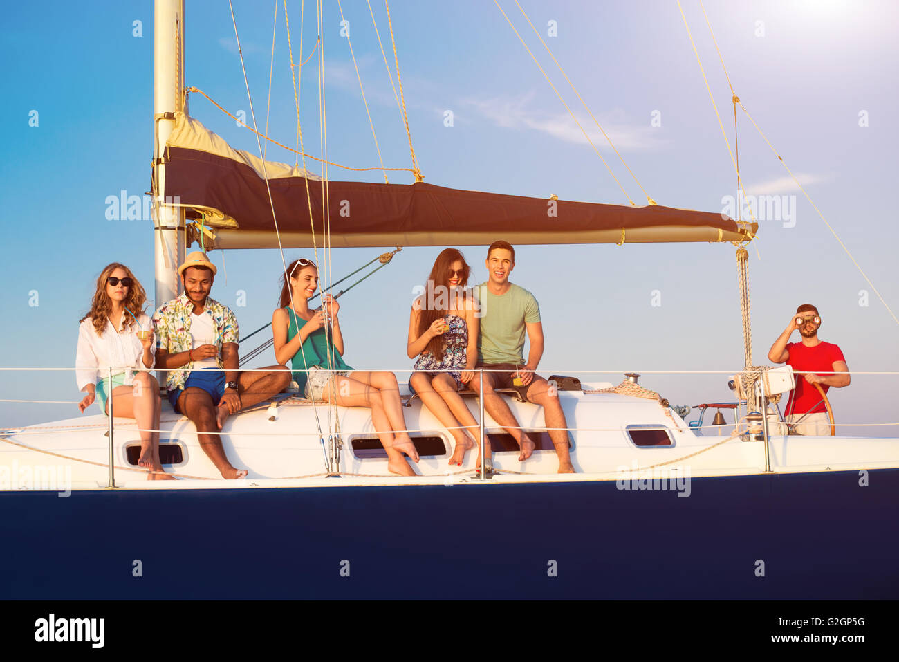 Small yacht on ocean sunset hi-res stock photography and images - Alamy