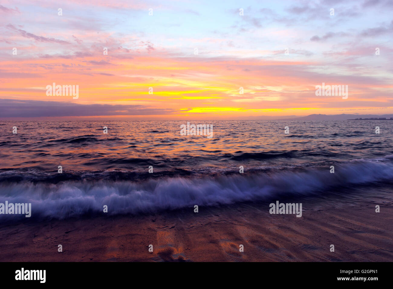 Ocean sunset is a brightly lit golden seascape with a gentle wave ...