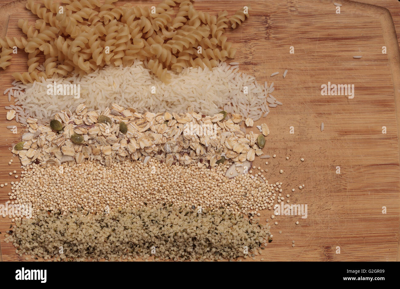 Multiple organic grains, including fusilli, jasmine rice, quinoa, hemp ...