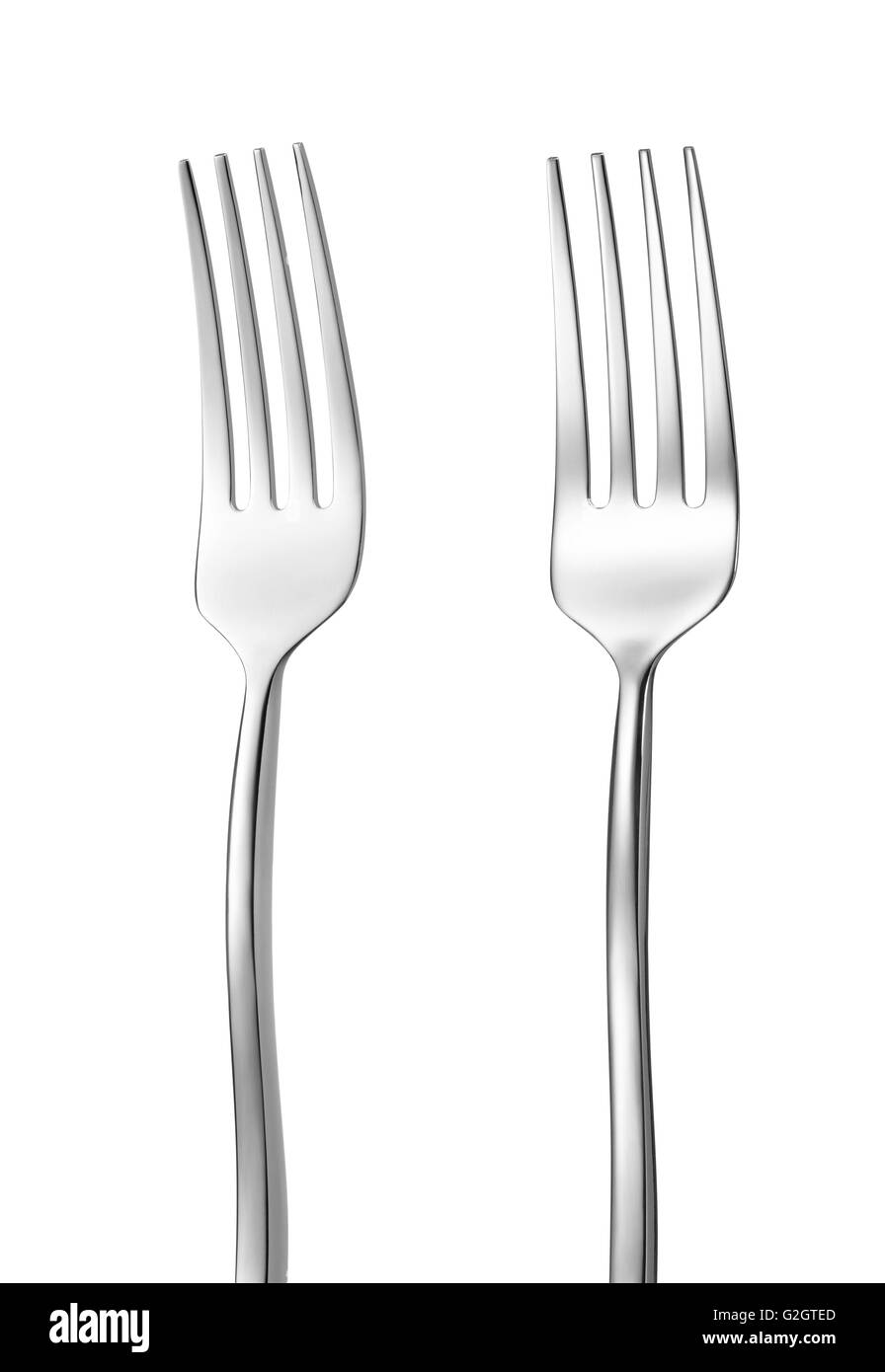 two steel forks isolated on white background Stock Photo - Alamy