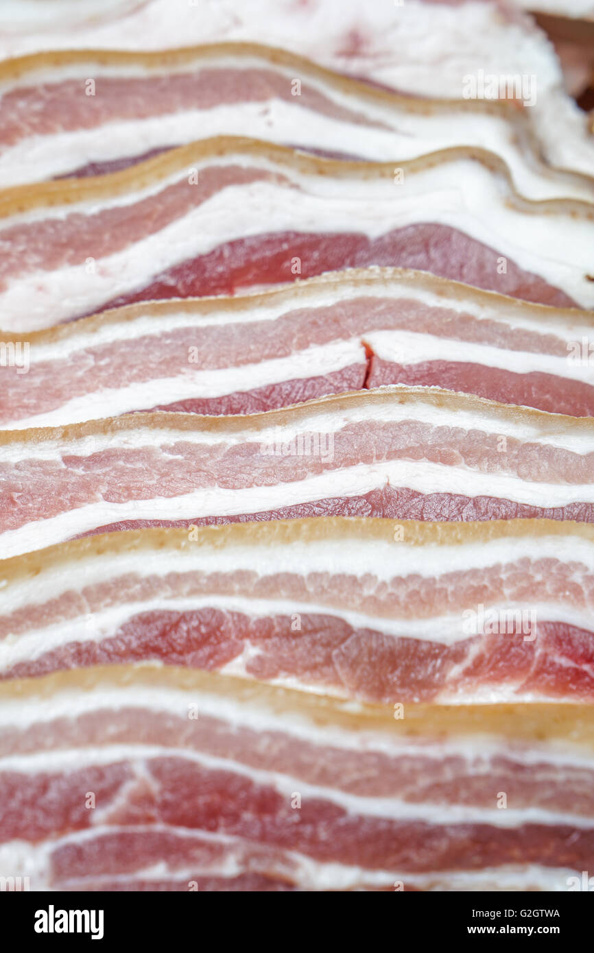 Raw Bacon, pork belly, ready for cooking and frying Stock Photo - Alamy