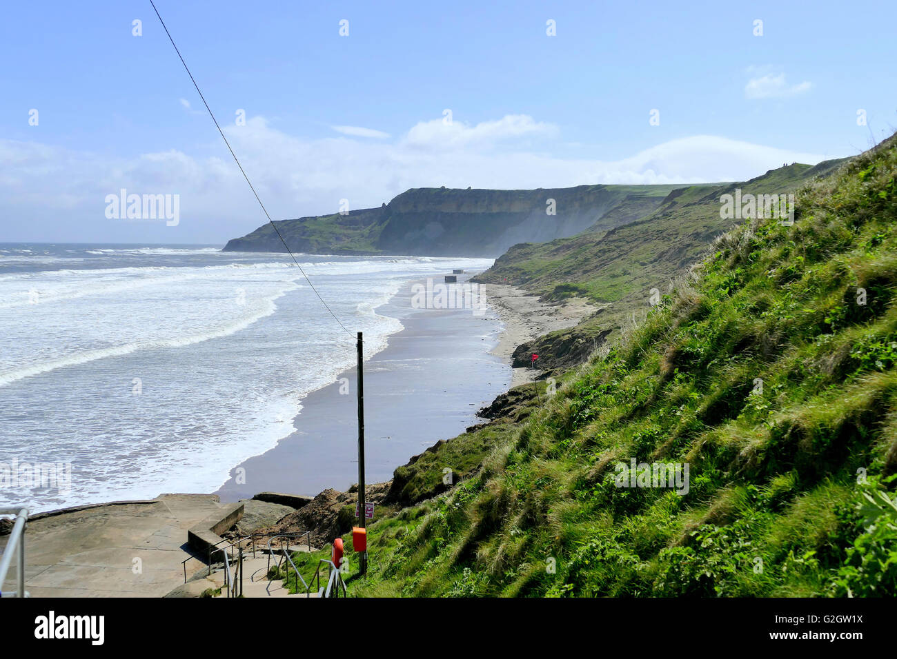 CAYTON BAY, YORKSHIRE, UK. MAY 14, 2016. A view of the beach at high ...
