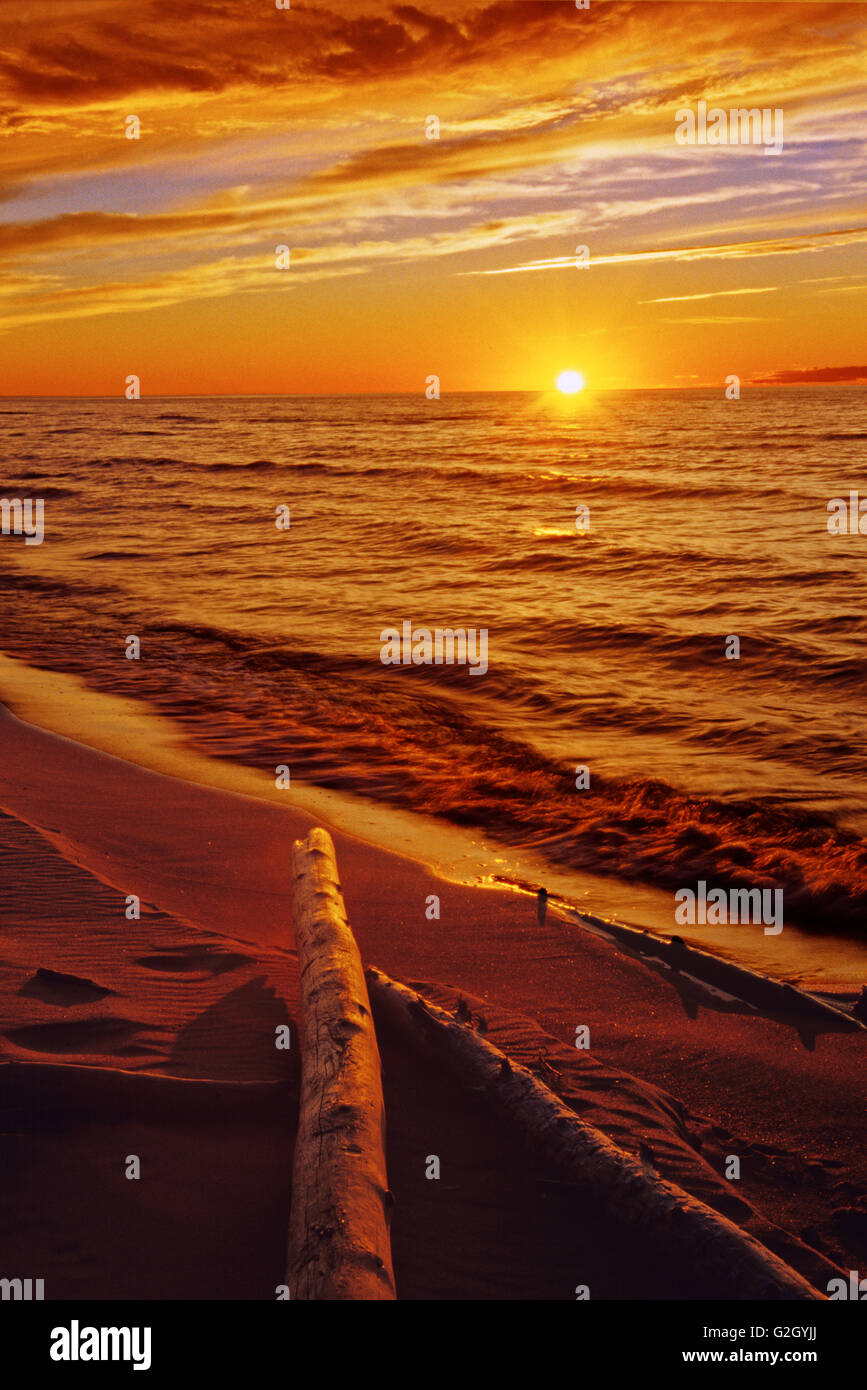 Driftwood on shore of Great Slave Lake at sunset Hay River Northwest ...