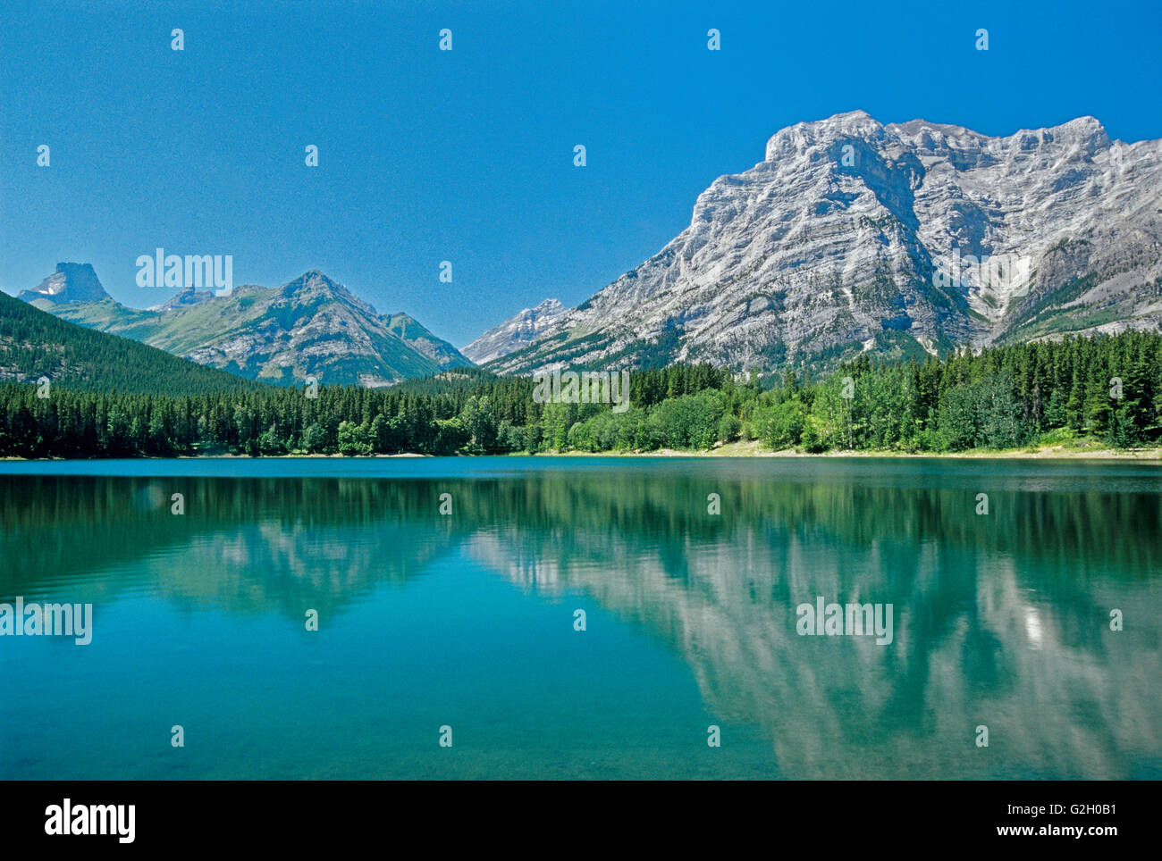 Canadian Rocky Mountains reflected in Wedge Pond Waterton Lakes ...