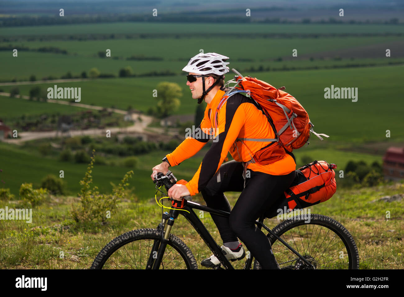 Man cycling through country road hi-res stock photography and images ...