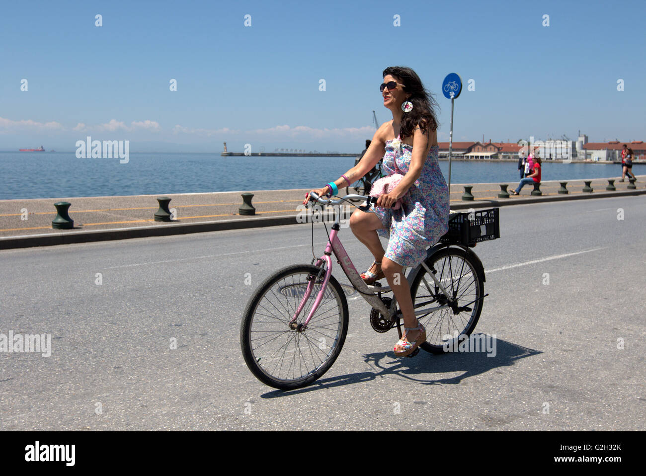 Woman cycling promenade hi-res stock photography and images - Alamy