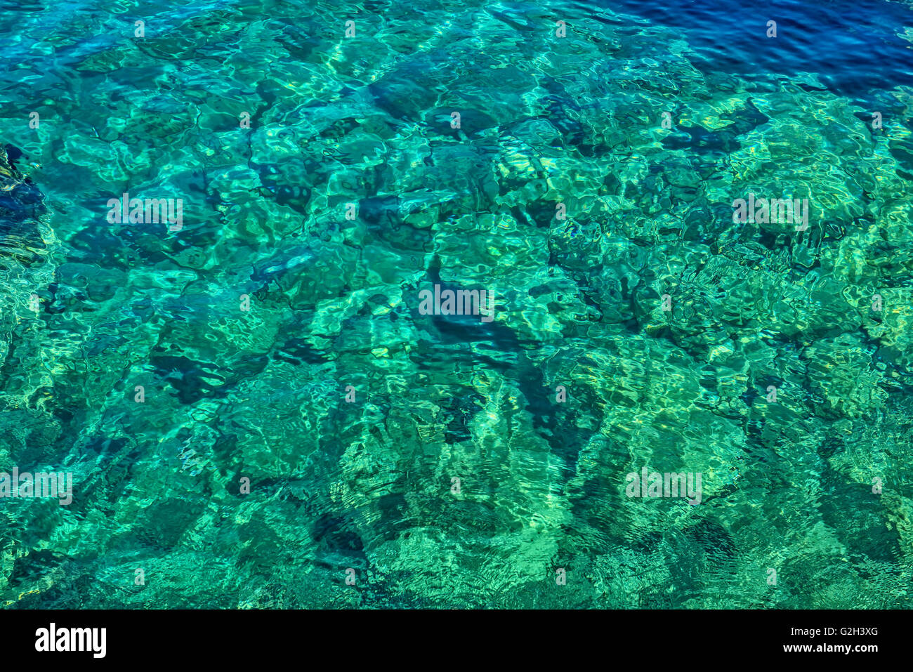 Water of Mediterranean Sea clear with small waves and tiny fishes Stock ...