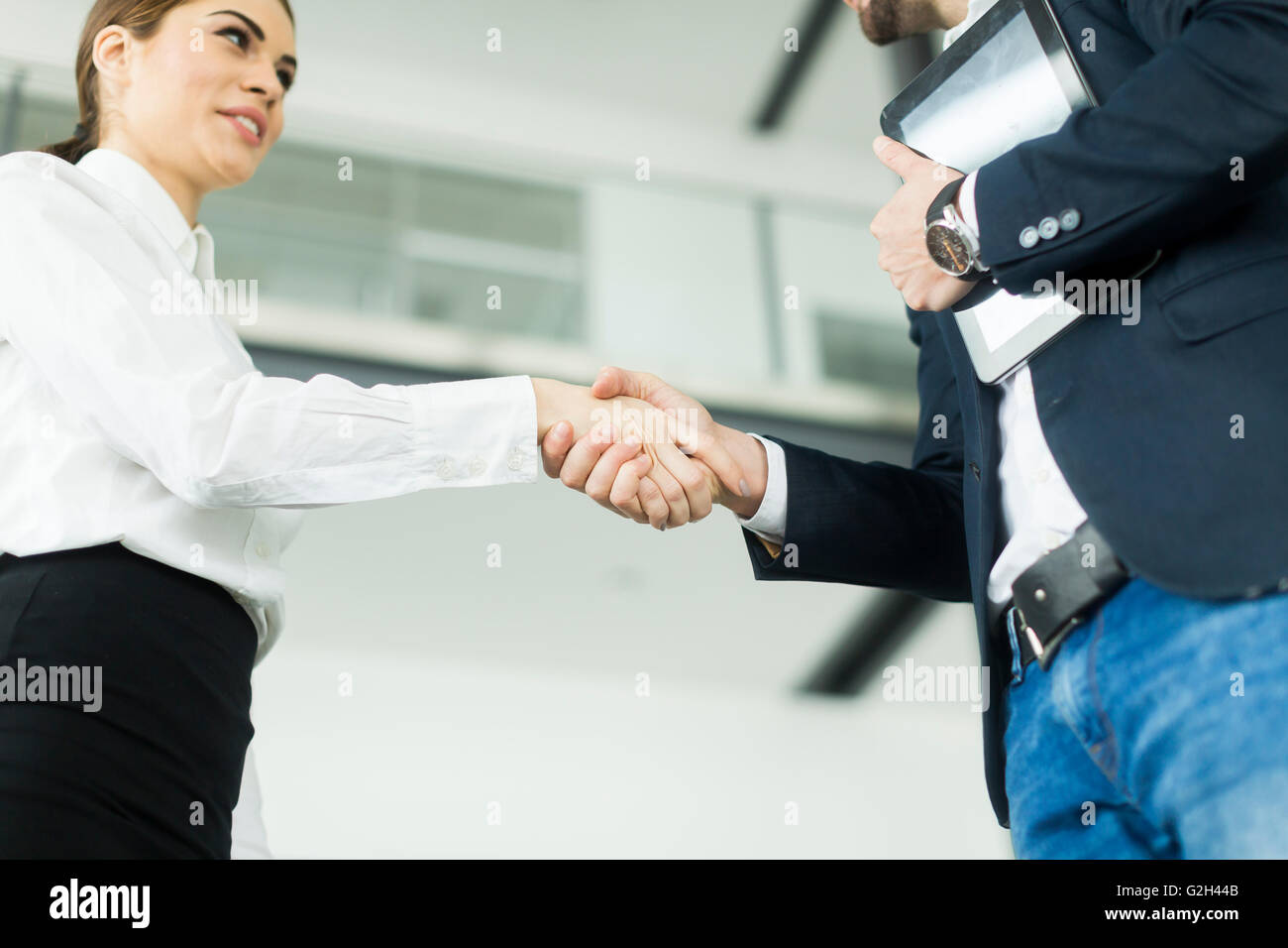 Business people shaking hands in the office Stock Photo - Alamy