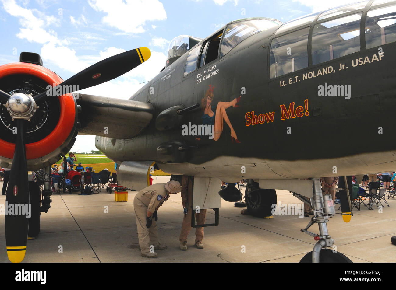 A World War II era B-25 light bomber with nose art displayed at an ...