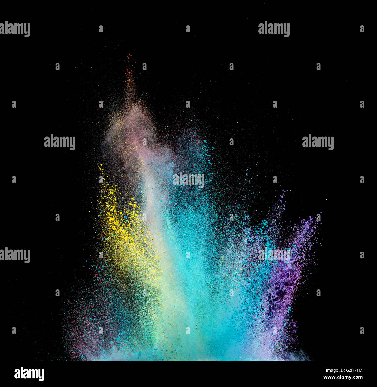 Colored powder exploding in abstract shape, isolated on black ...