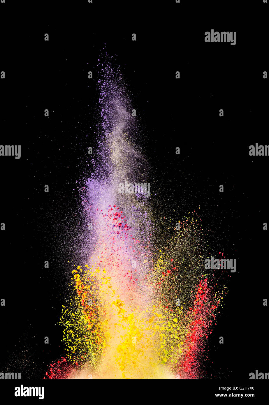 Colored powder exploding in abstract shape, isolated on black ...