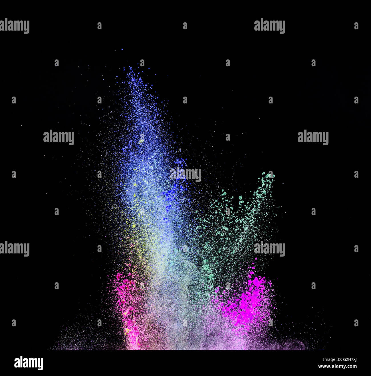 Colored powder exploding in abstract shape, isolated on black ...