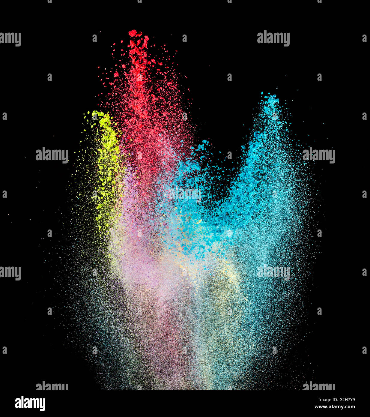 Colored powder exploding in abstract shape, isolated on black ...
