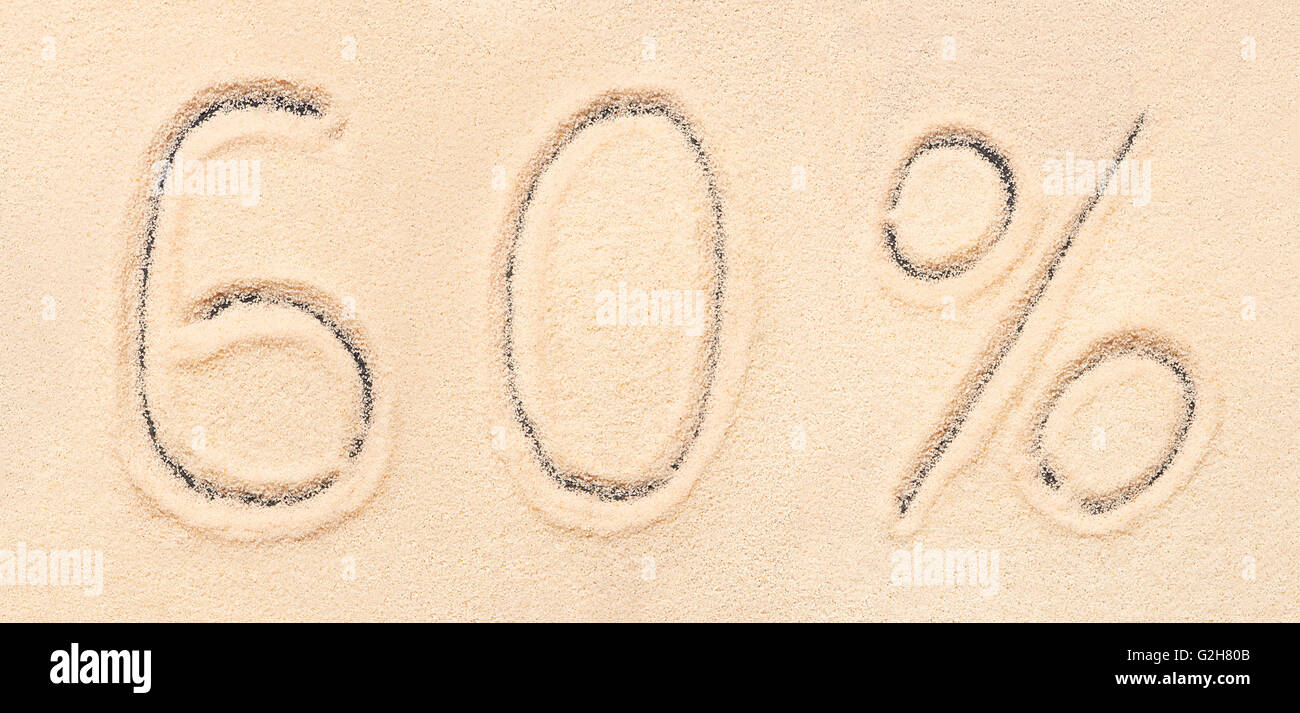 60 % lettering written on sand. Summer beach background Stock Photo - Alamy