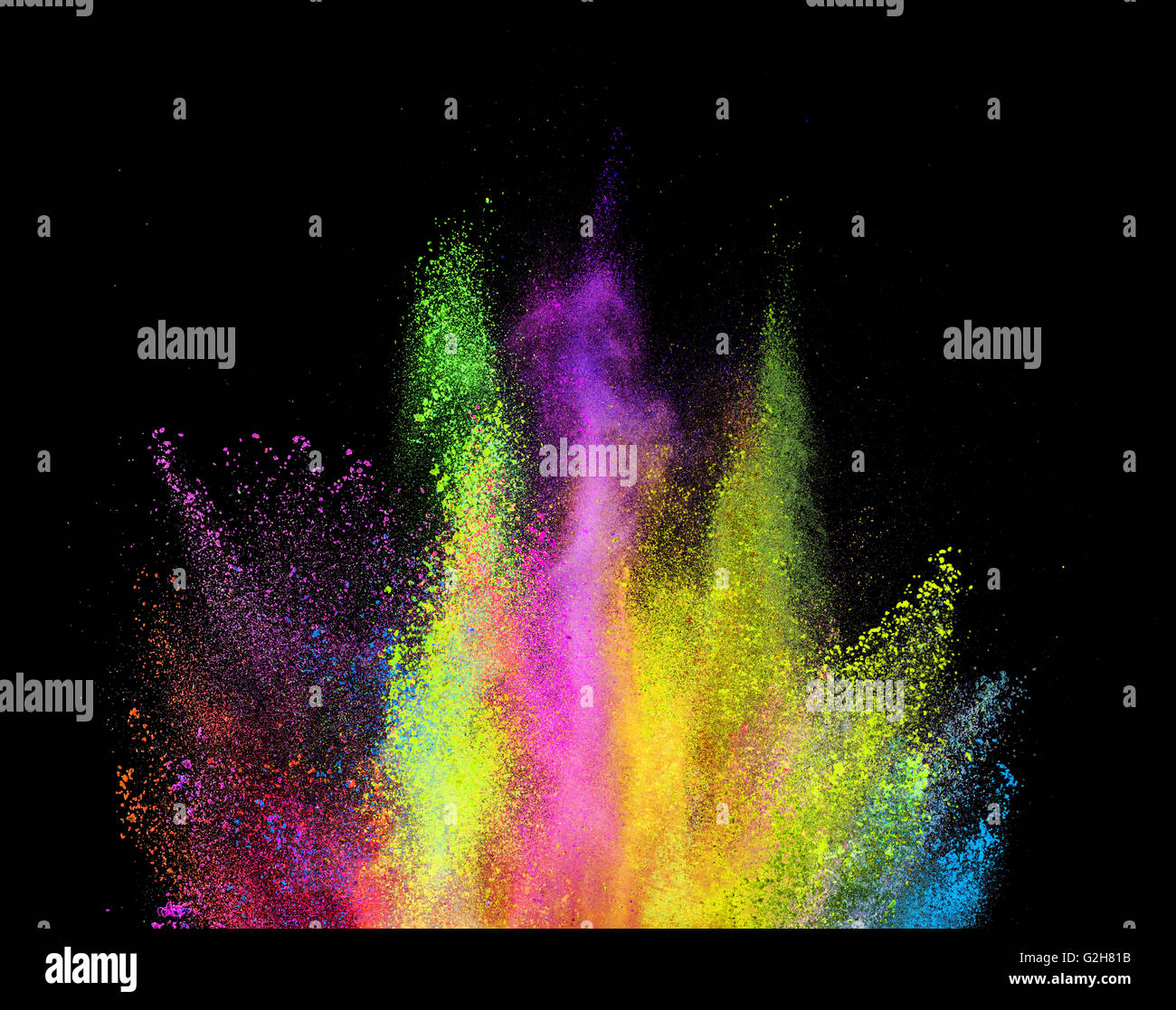 Colored powder exploding in abstract shape, isolated on black ...