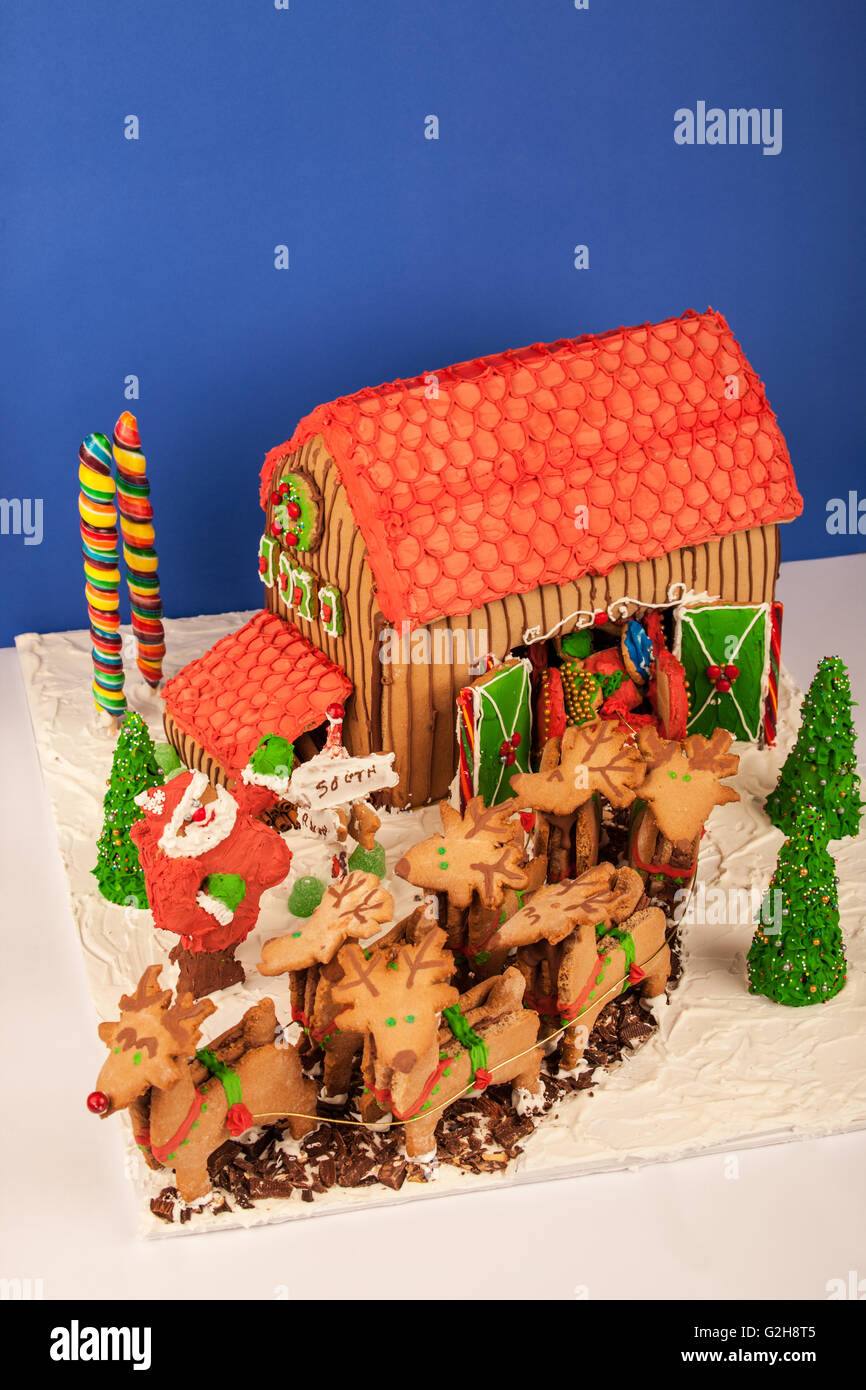 Homemade gingerbread setup of Santa's barn, sled, reindeer and Santa ...