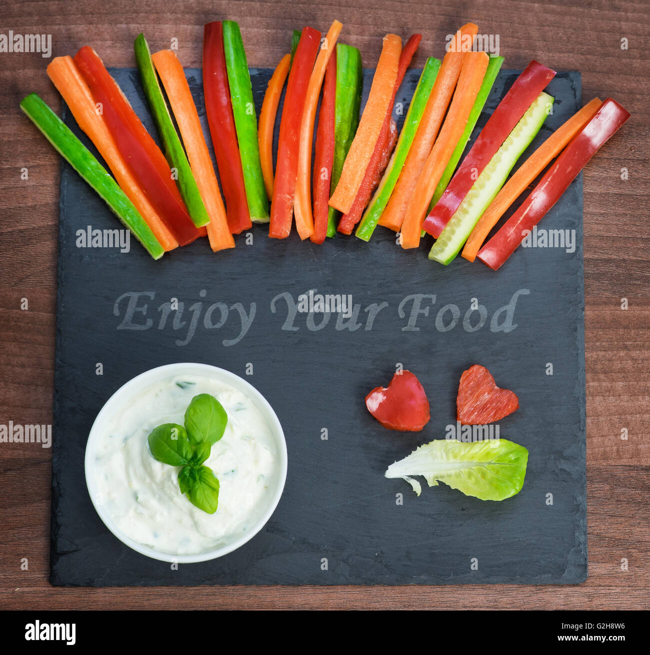 Colorful vegetable sticks with a spicy dip Stock Photo - Alamy