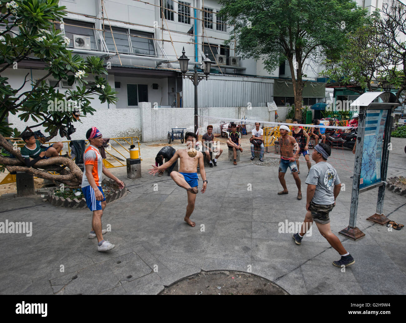 Locals playing sepak takraw (kick volleyball) in Bangkok, Thailand ...