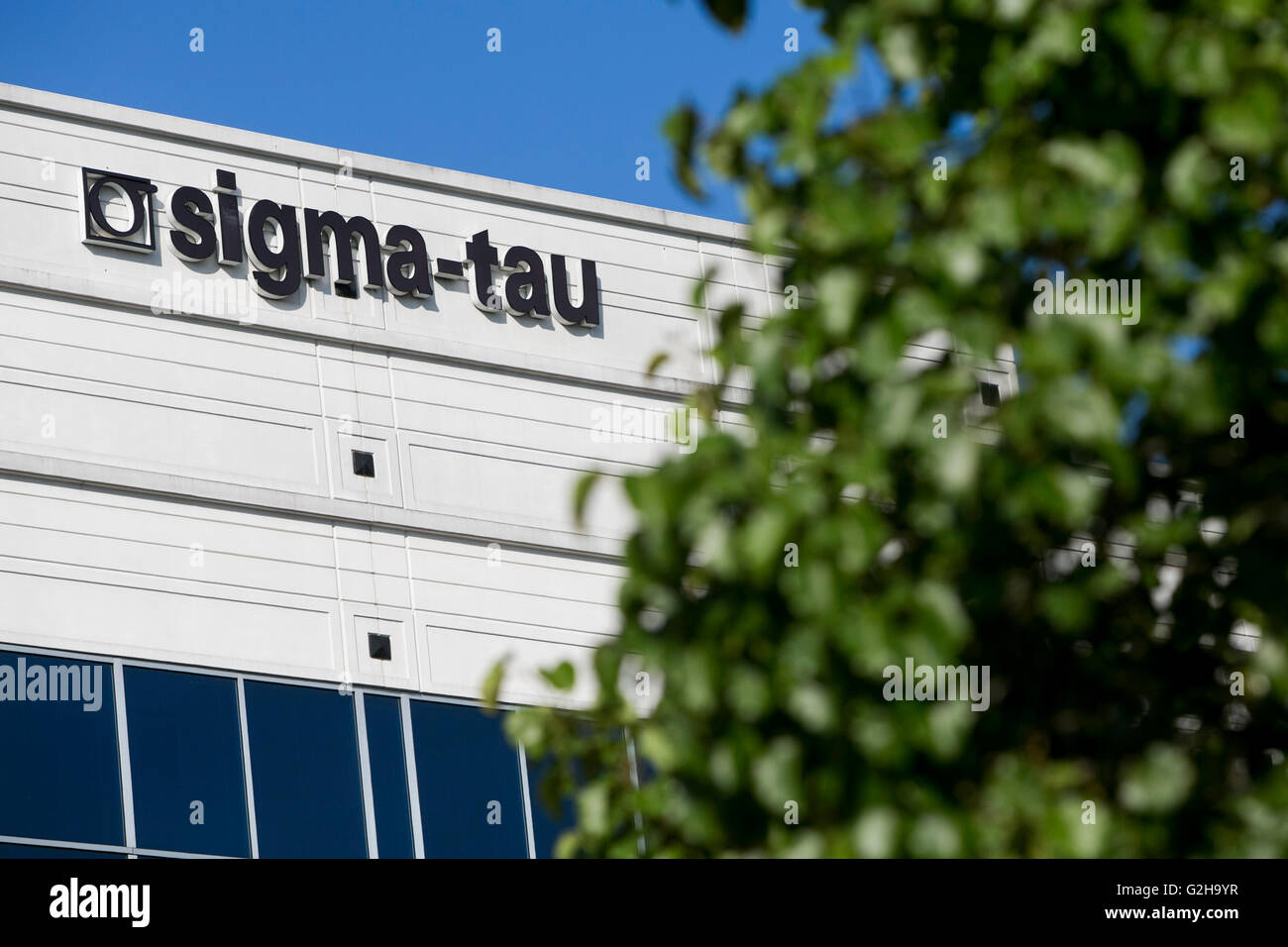 A logo sign outside of a facility occupied by Sigma-Tau Pharmaceuticals ...