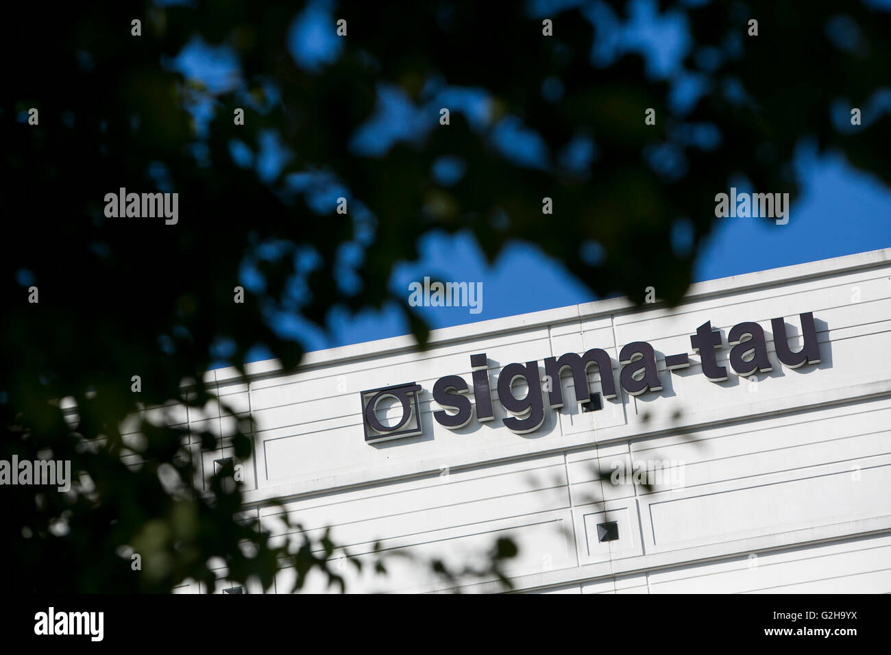A logo sign outside of a facility occupied by Sigma-Tau Pharmaceuticals ...