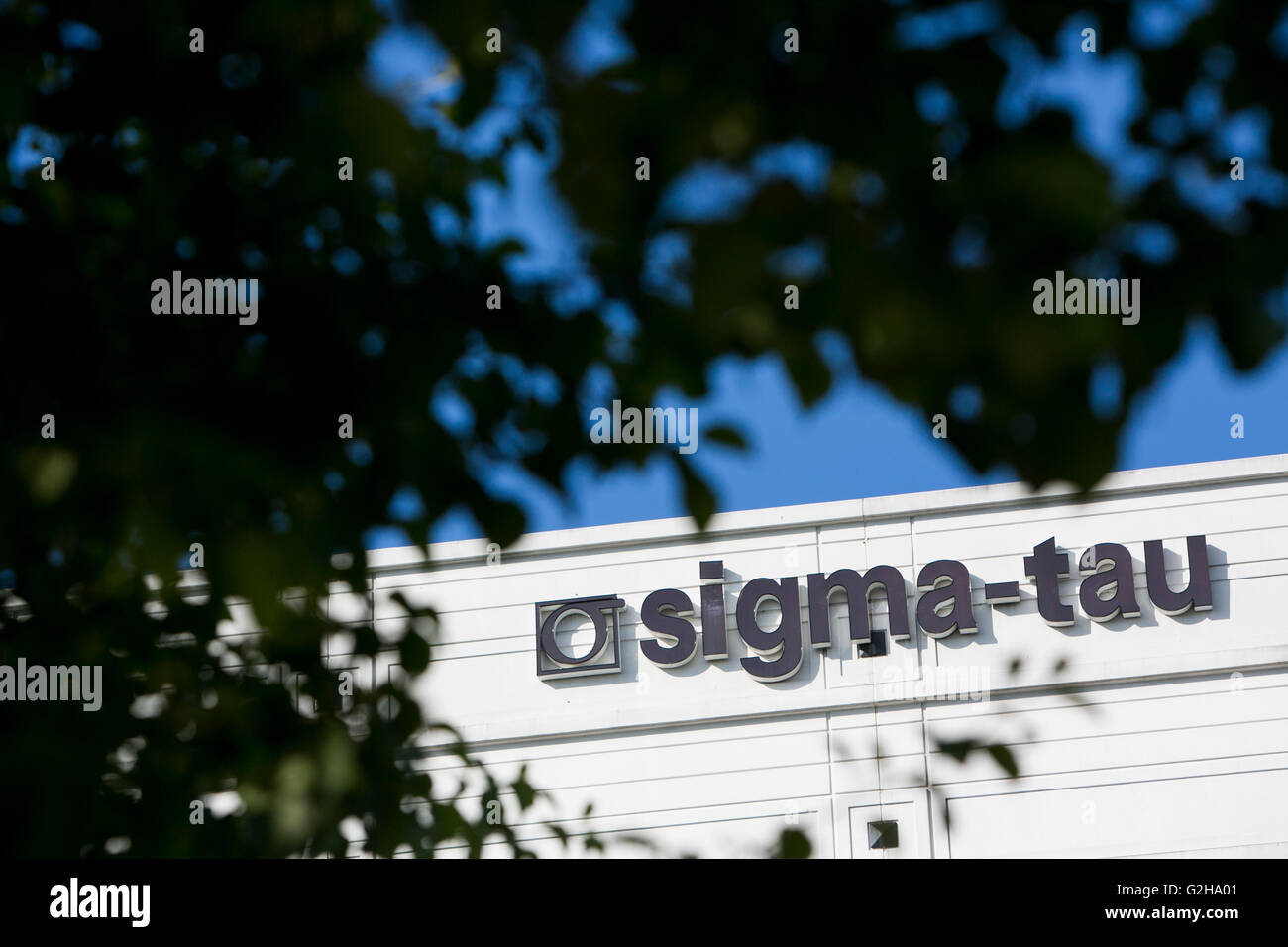 A logo sign outside of a facility occupied by Sigma-Tau Pharmaceuticals ...