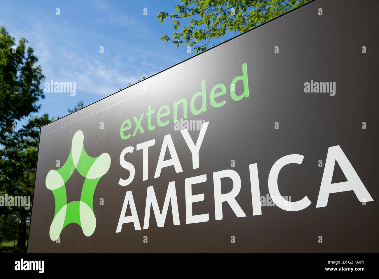 A logo sign outside of an Extended Stay America hotel in Gaithersburg ...
