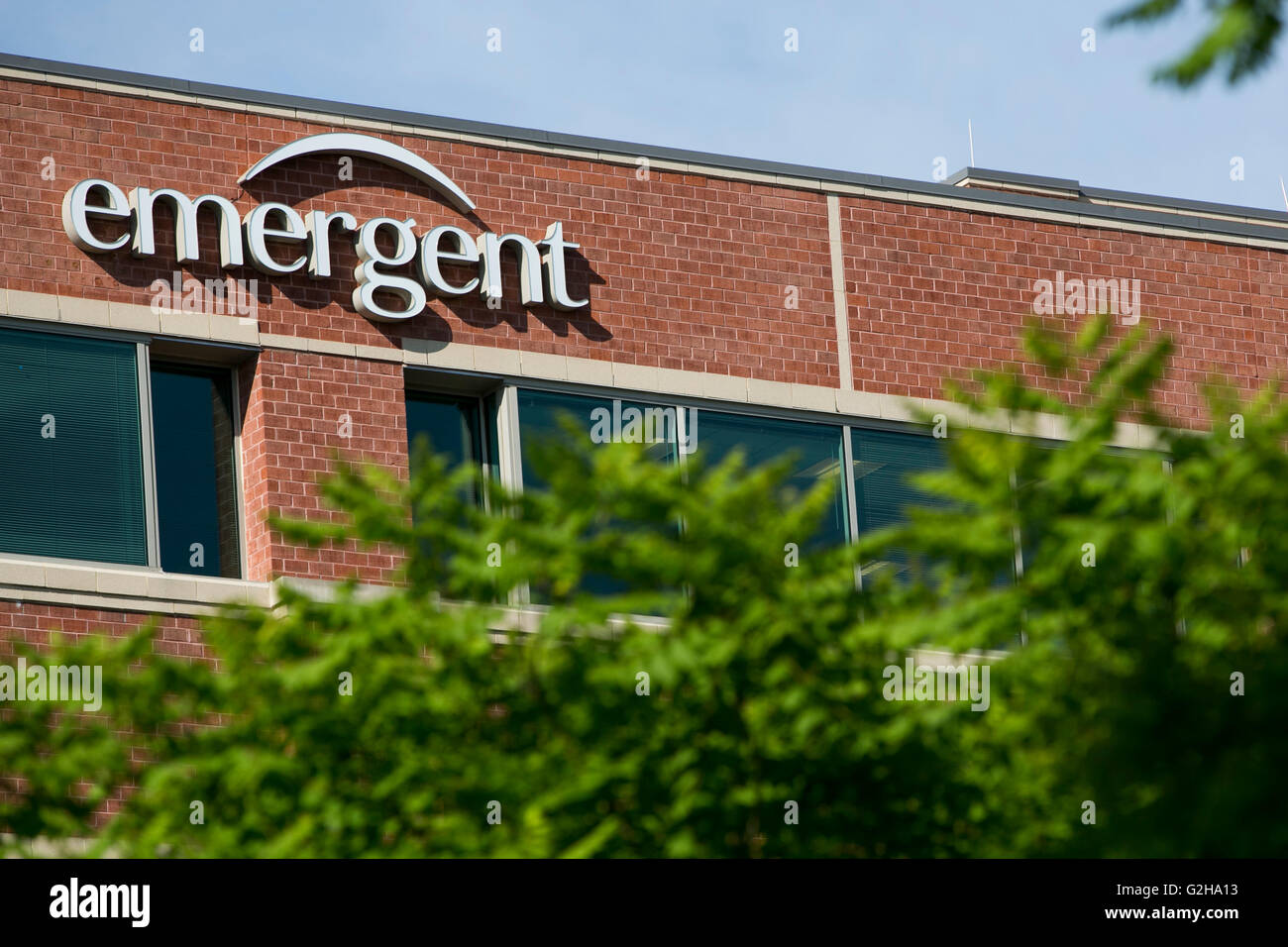 A logo sign outside of the headquarters of Emergent BioSolutions in ...