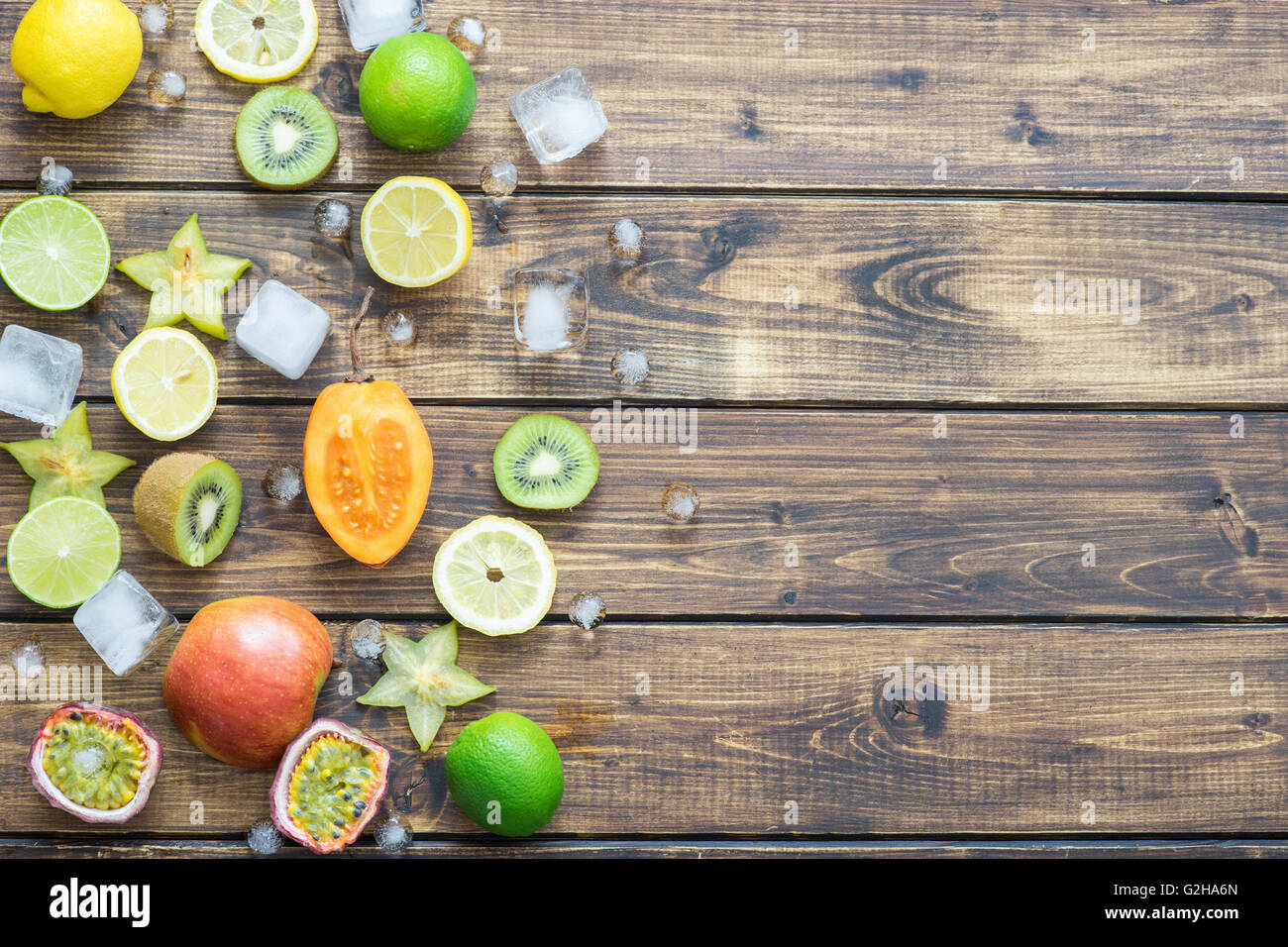 Tropical fruits with cubes of ice Stock Photo - Alamy