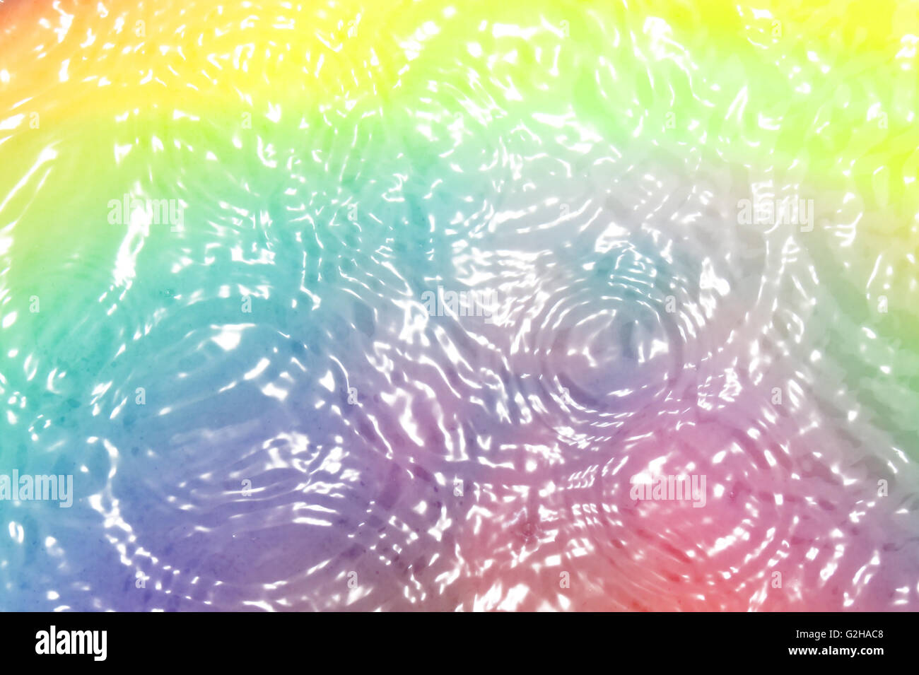 An abstract background with a beautiful of colorful ripples in a liquid ...