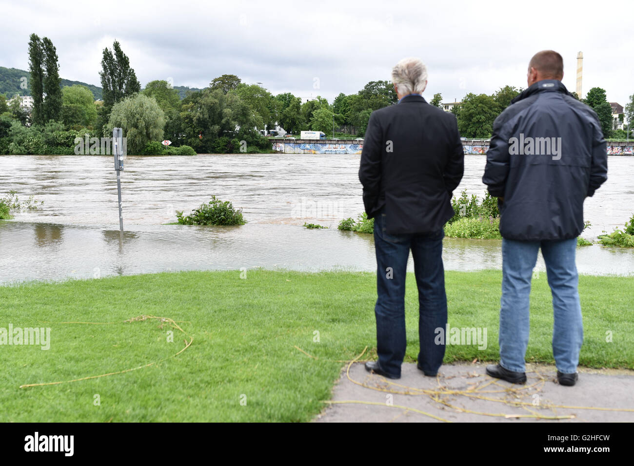 Heidelberg, Germany. 30th May, 2016. Two men stand at the flooded ...