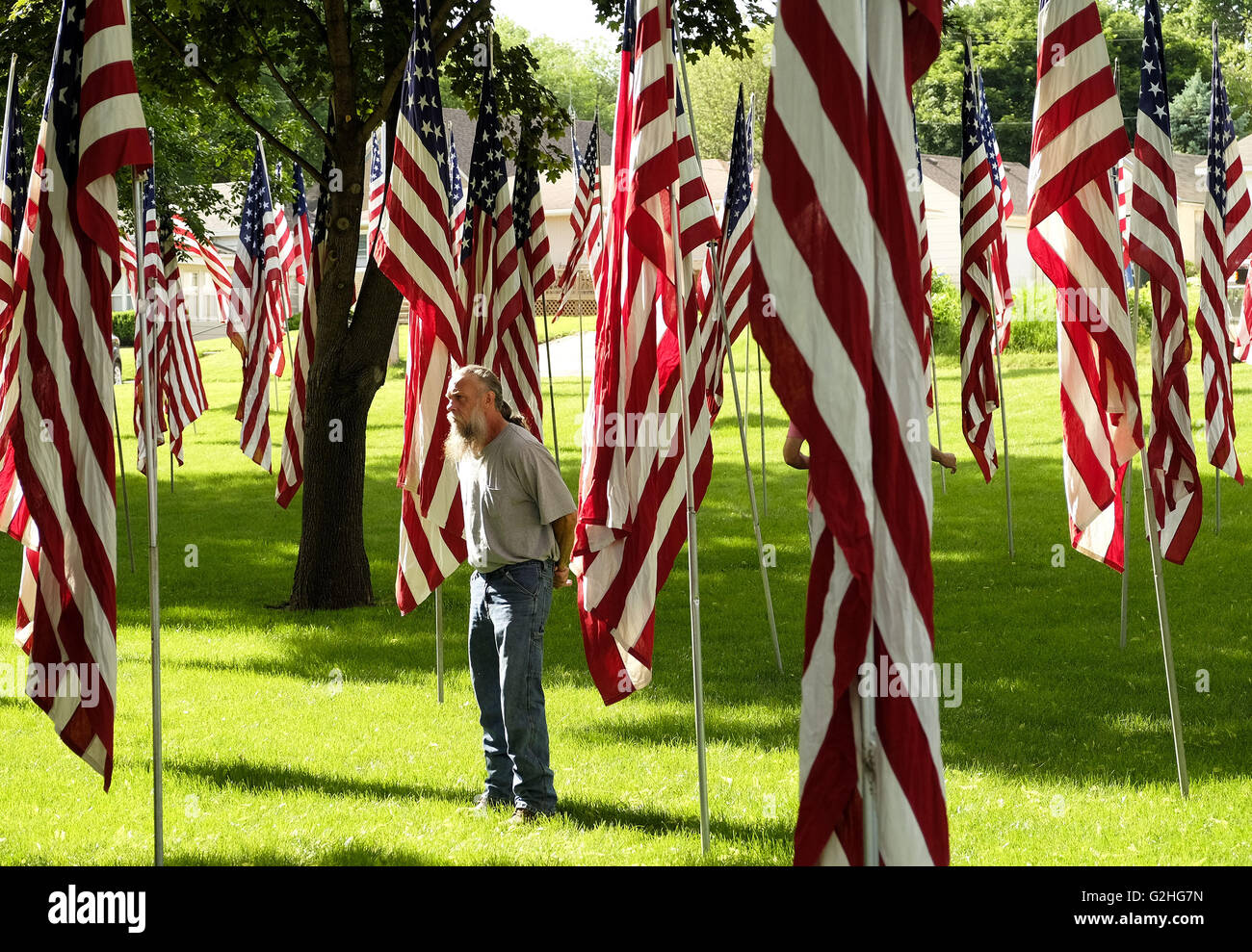 Le Mars, Iowa, USA. 30th May, 2016. LARRY STINTON looks for the flag ...
