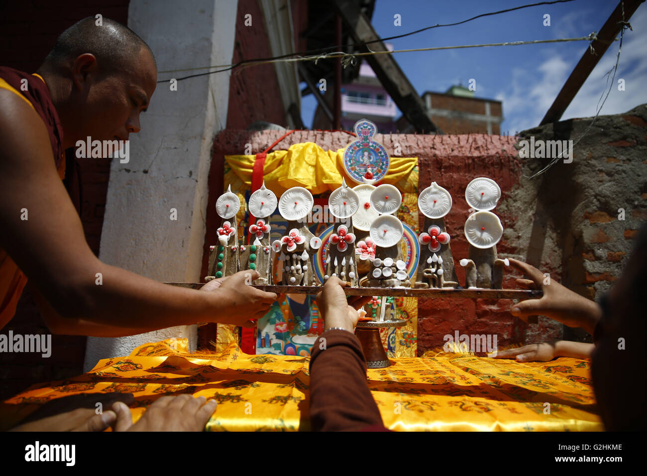 Kathmandu, Nepal. 31st May, 2016. Buddhist Monks arrange idols before ...