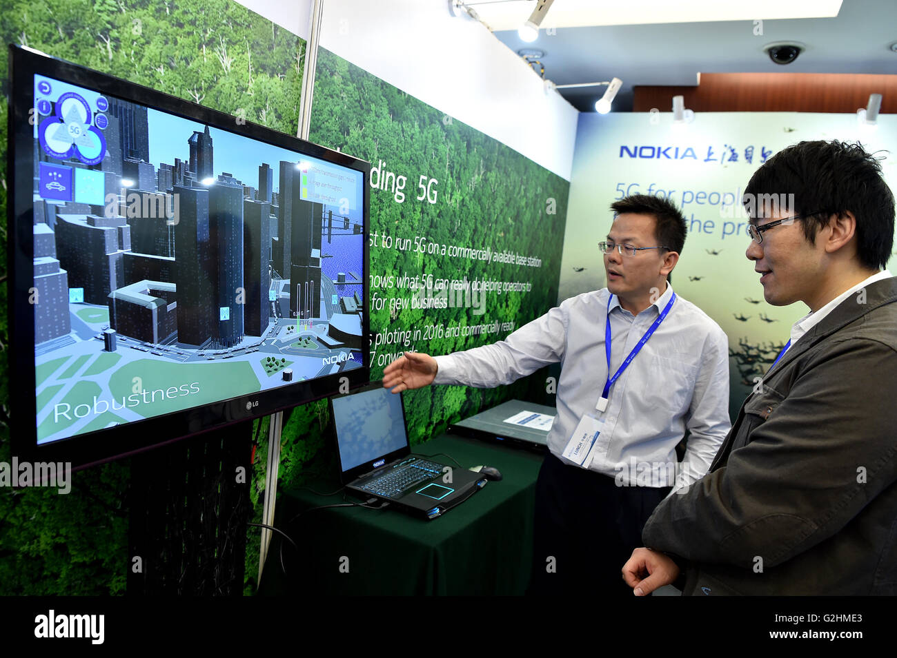 Beijing, China. 31st May, 2016. A visitor watches a technical ...