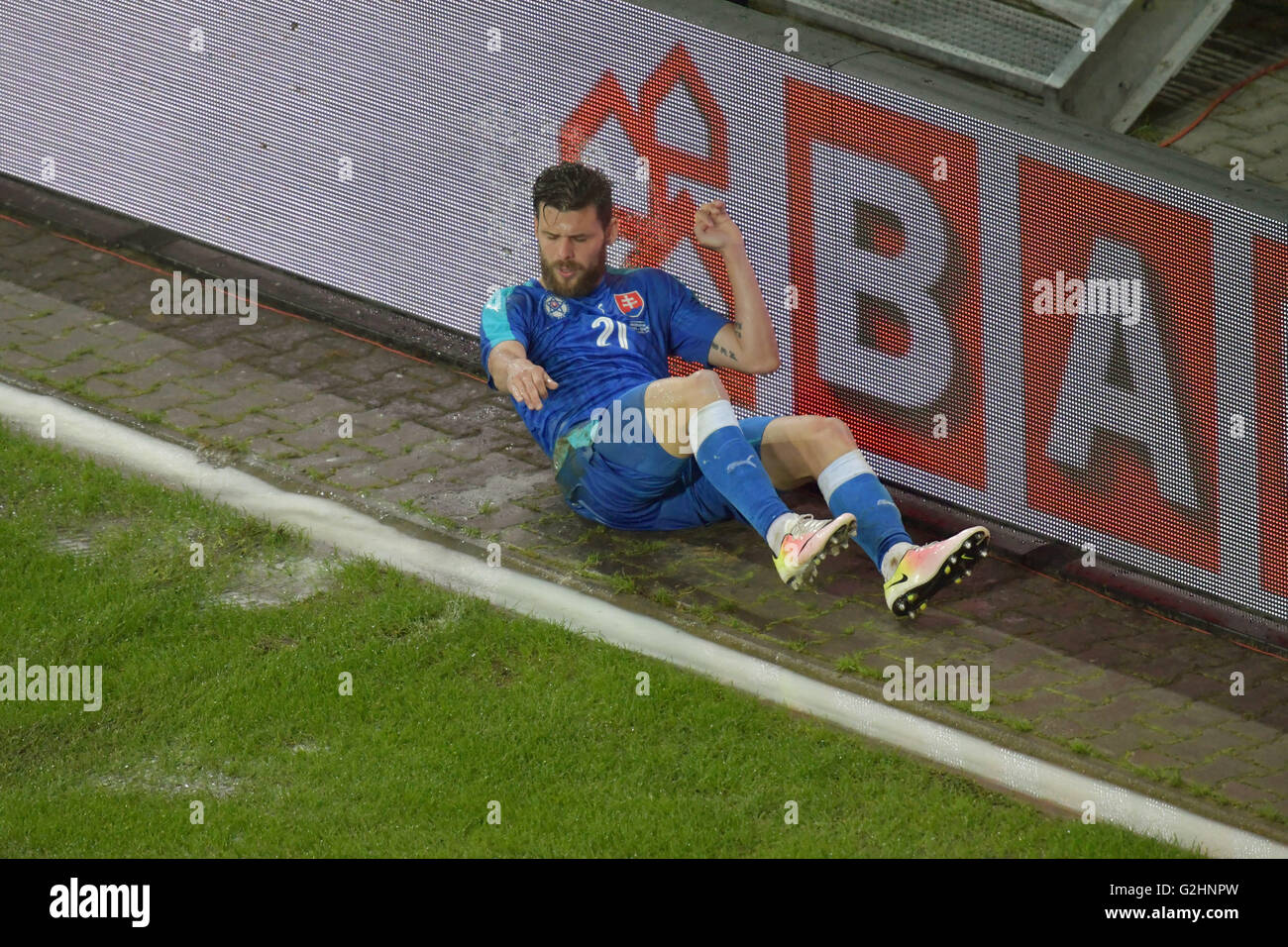 Slovakia's Michael Duris slipping at the international soccer match ...