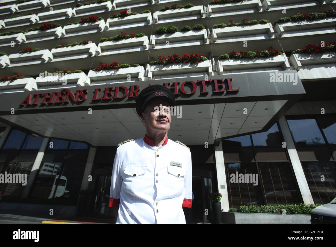 An employee stands outside the Ledra Hotel entrance, in Athens. Guests ...