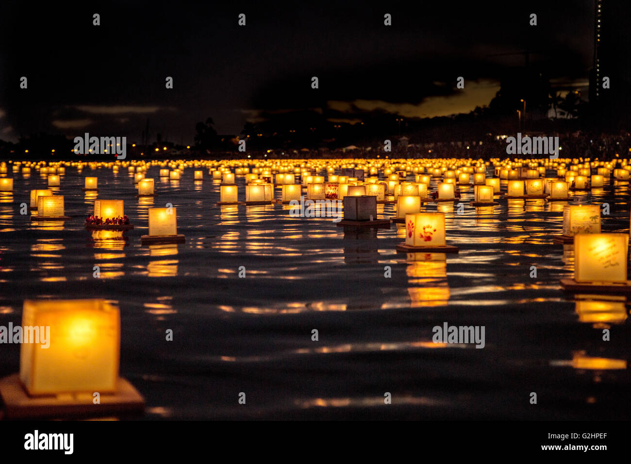 More than 6,000 candle-lit lanterns float across Honolulu harbor from ...