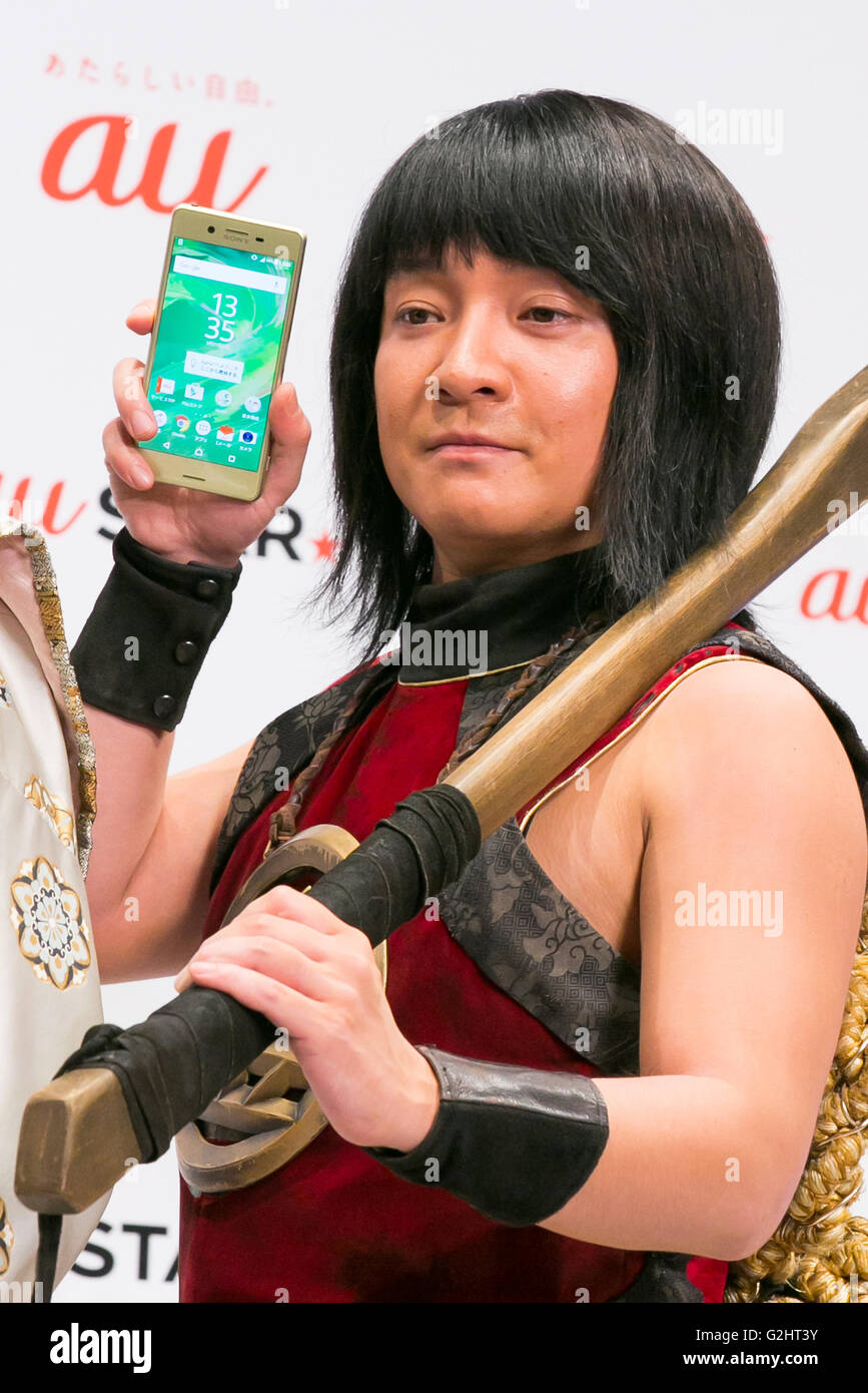 Japanese actor Gaku Hamada poses for the cameras holding a new mobile ...