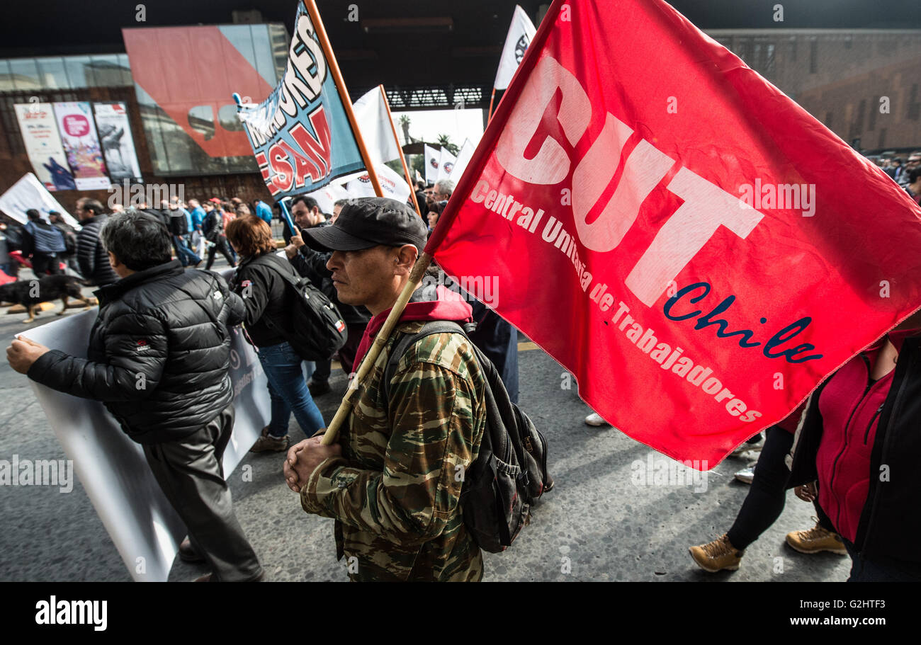 Santiago, Chile. 31st May, 2016. A demonstrator holds a flag during a ...