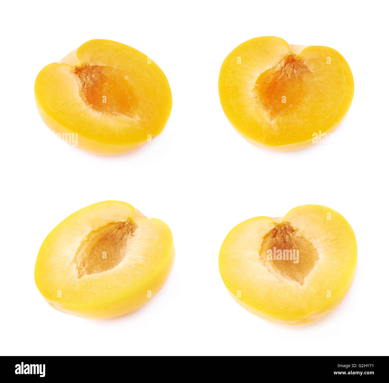 Cut open plum half isolated Stock Photo - Alamy