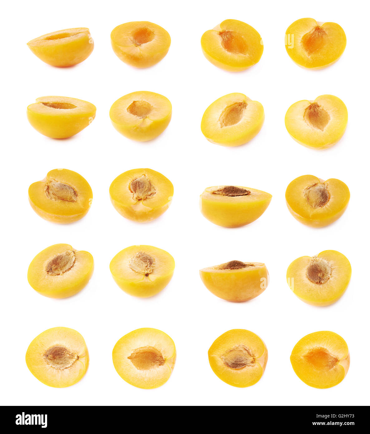 Cut open plum half isolated Cut Out Stock Images & Pictures - Alamy