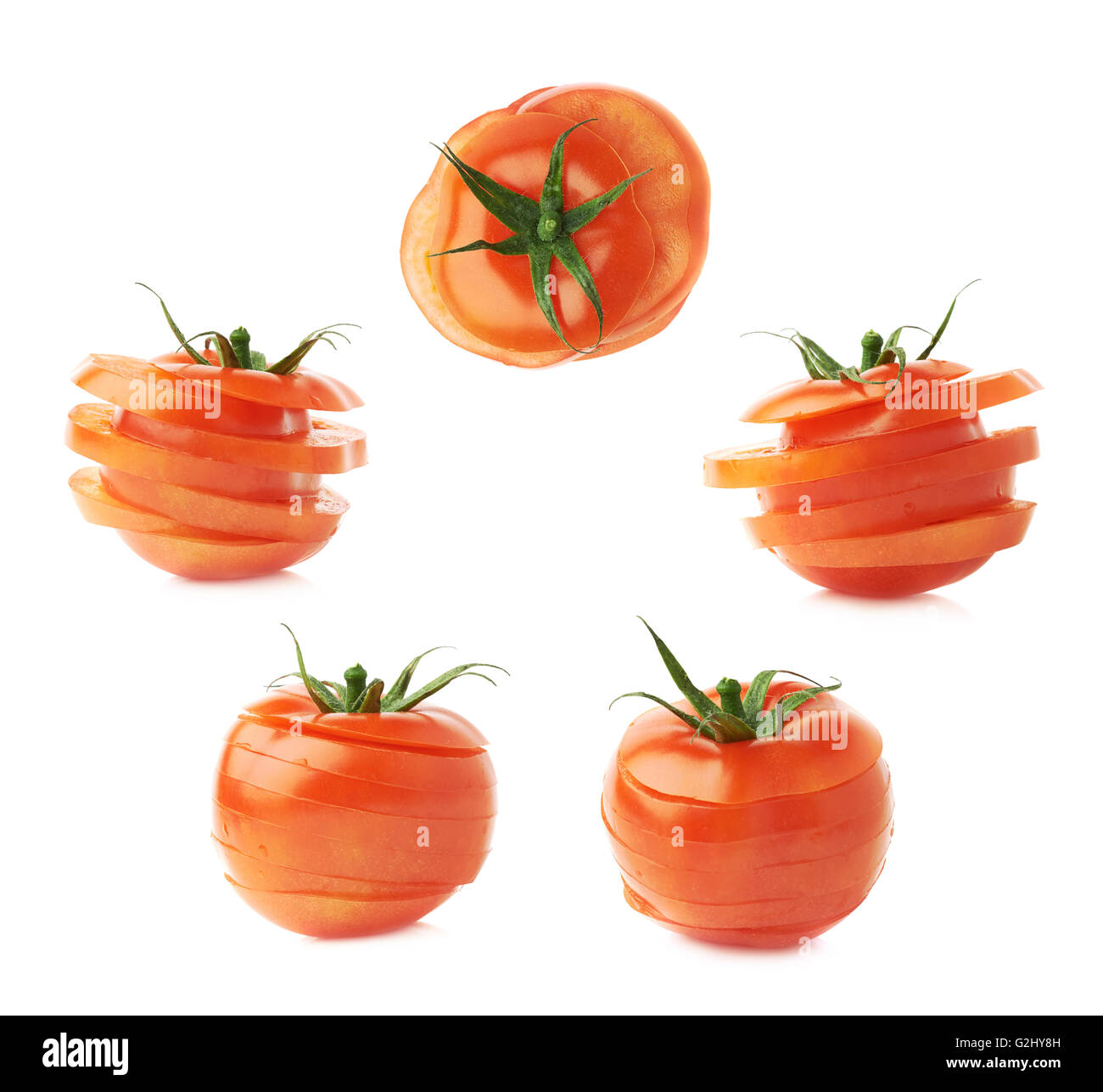 Tomato cut in slices isolated Stock Photo - Alamy