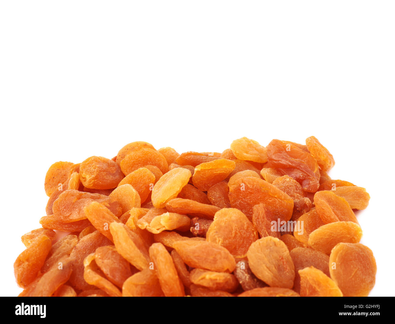 Dried orange apricots over white background Stock Photo - Alamy