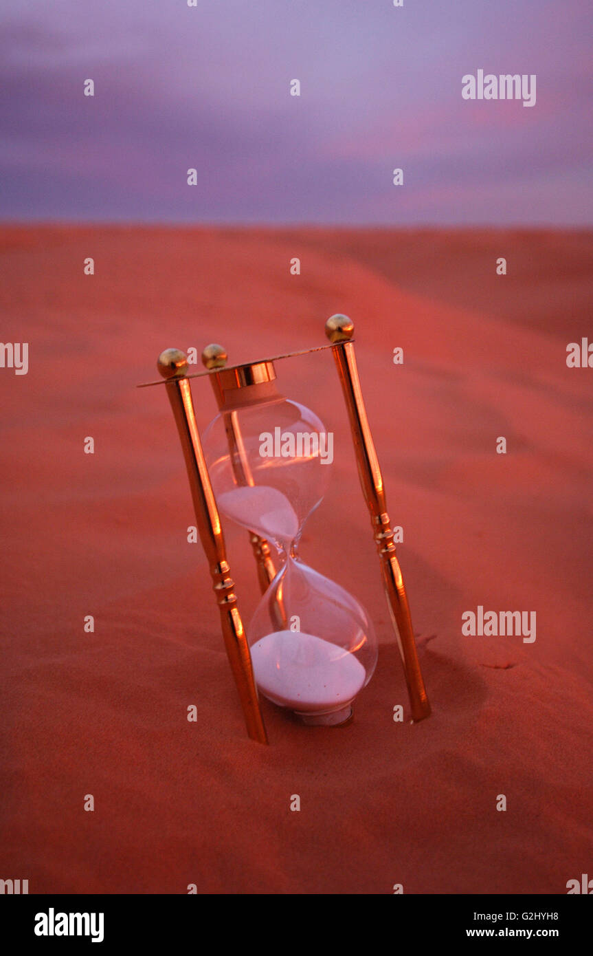 Clocks in sand hi-res stock photography and images - Alamy