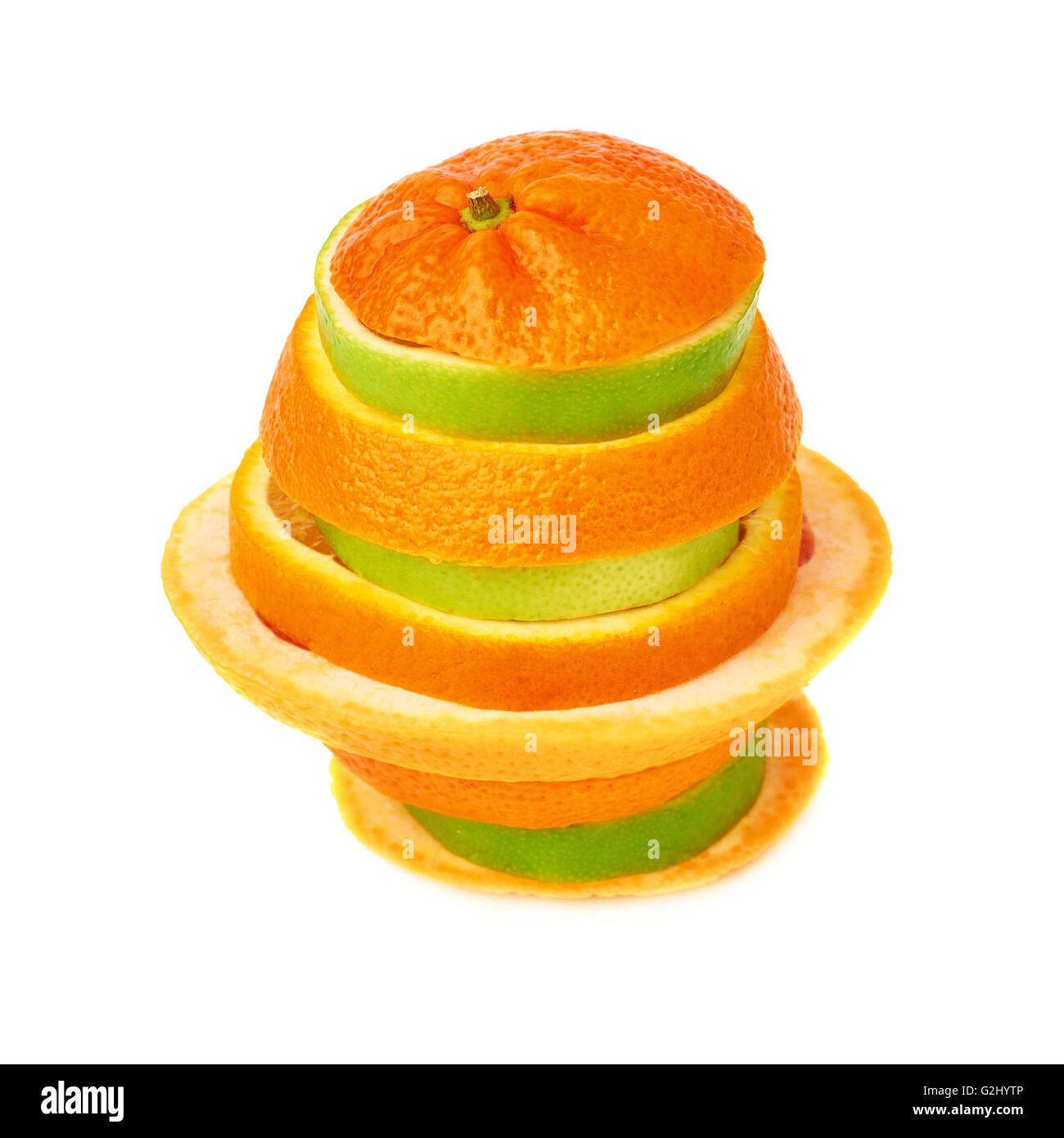 Stack of citrus sliced fruits over white isolated background Stock ...