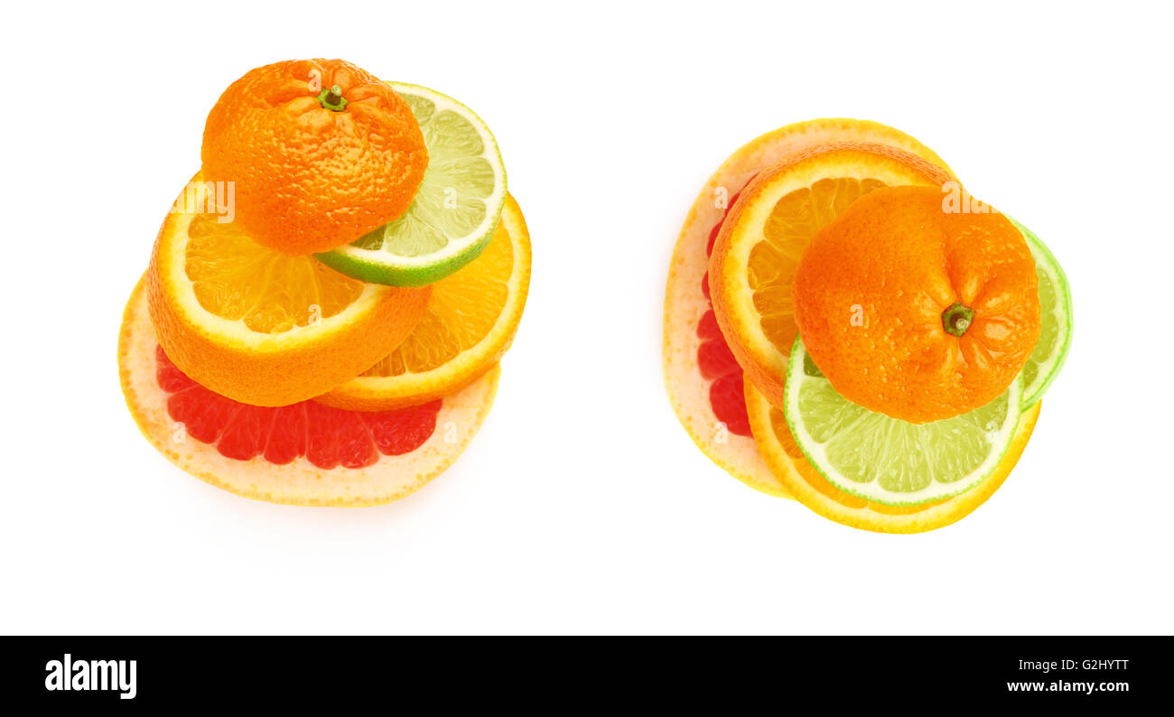 Stack of citrus sliced fruits over white isolated background Stock ...