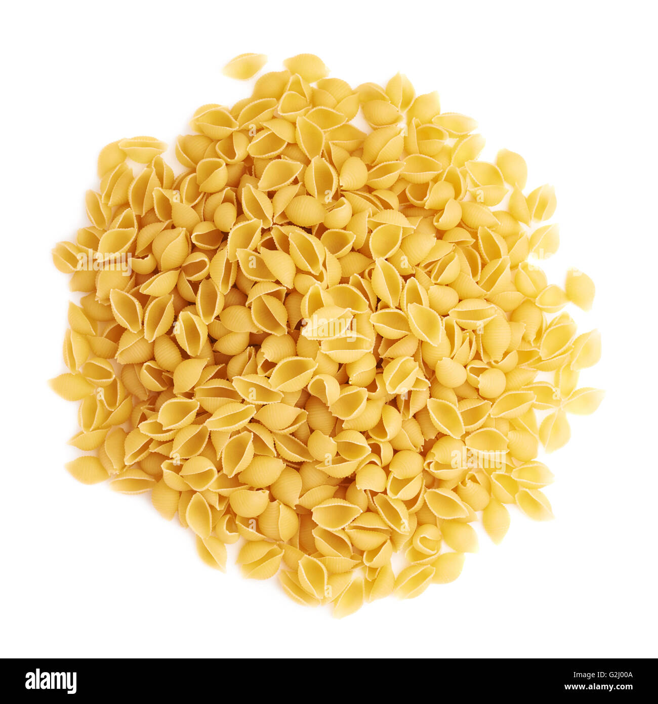 Pile of dry conchiglie pasta over isolated white background Stock Photo ...