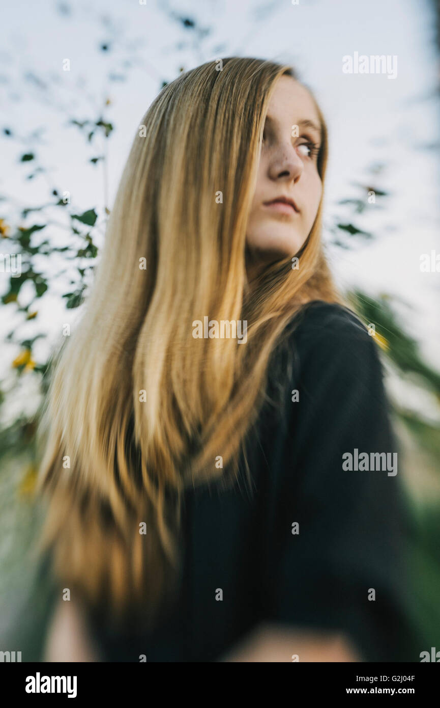 Portrait of Teen Girl Looking Over Shoulder Stock Photo - Alamy
