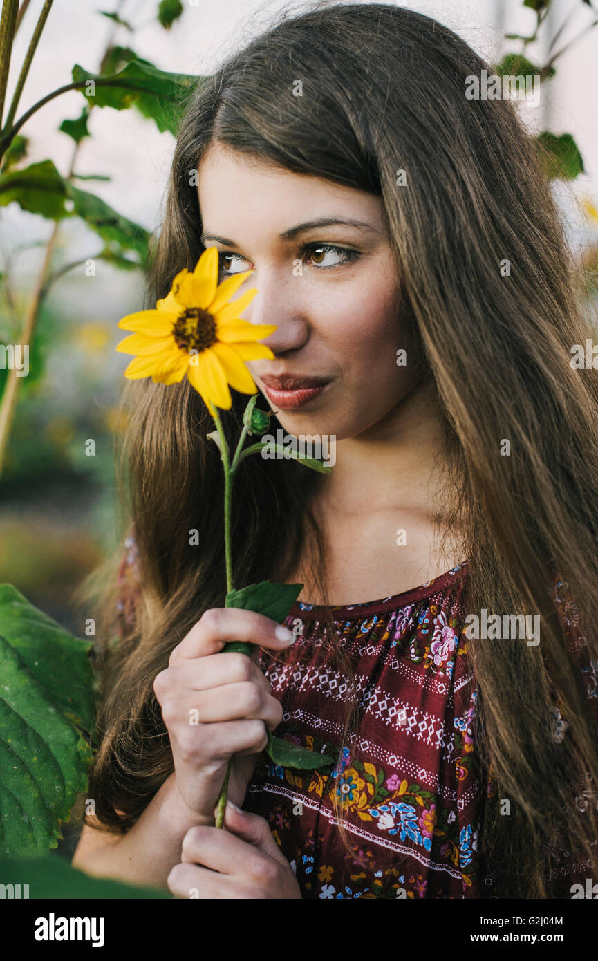 Girl Holding Yellow Flower Portrait High Resolution Stock Photography ...