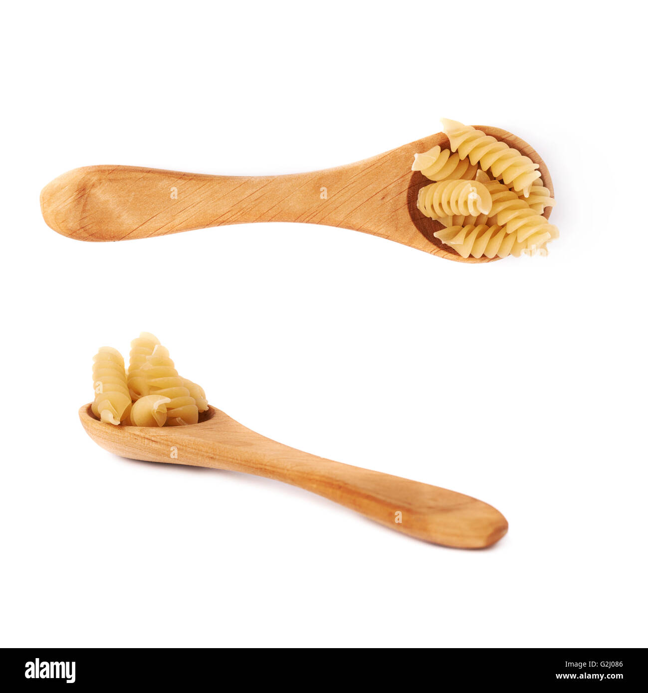 Set of wooden spoon filled with dry rotini pasta over isolated white ...