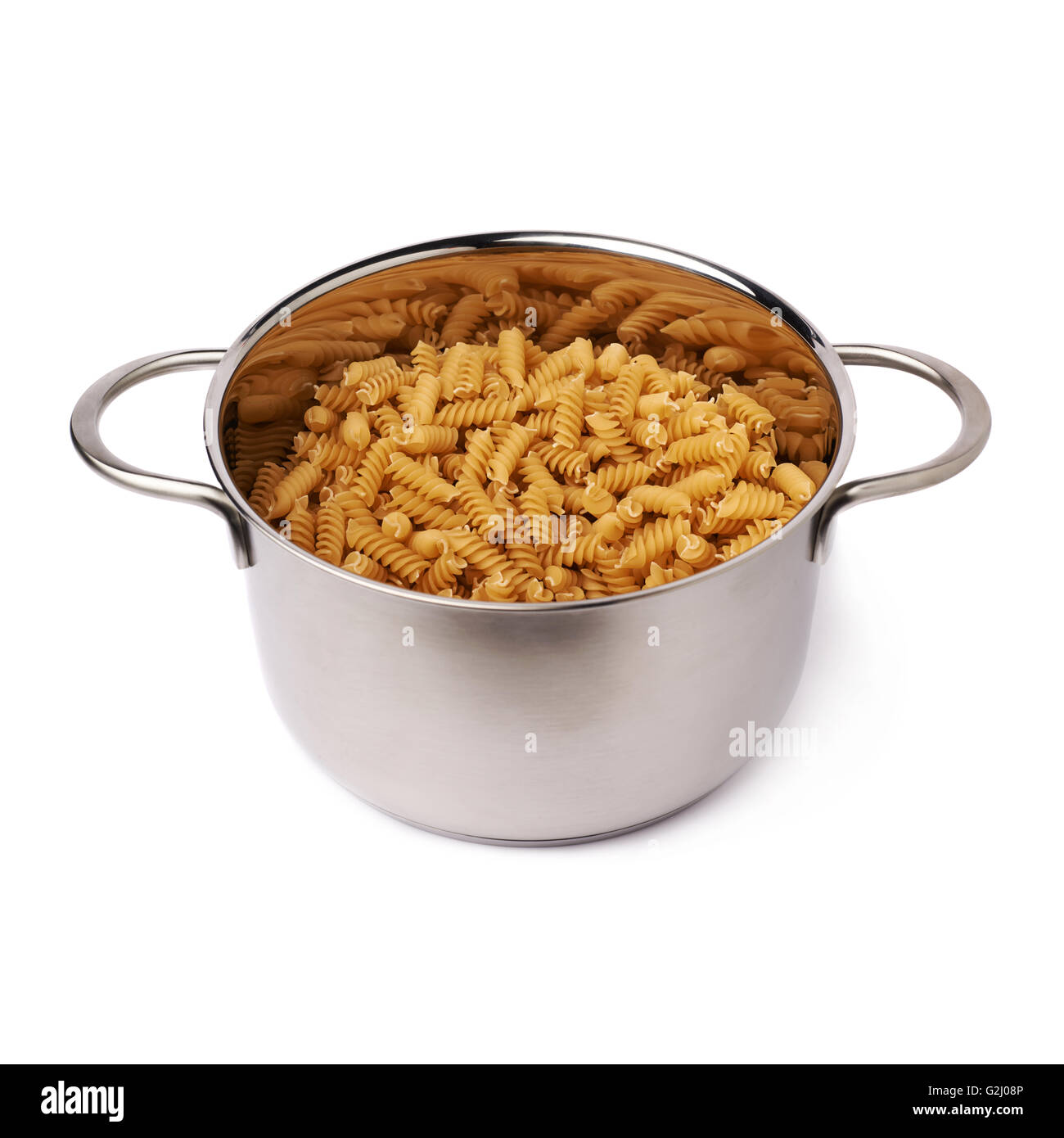 Metal pan filled with dry rotini pasta over isolated white background ...
